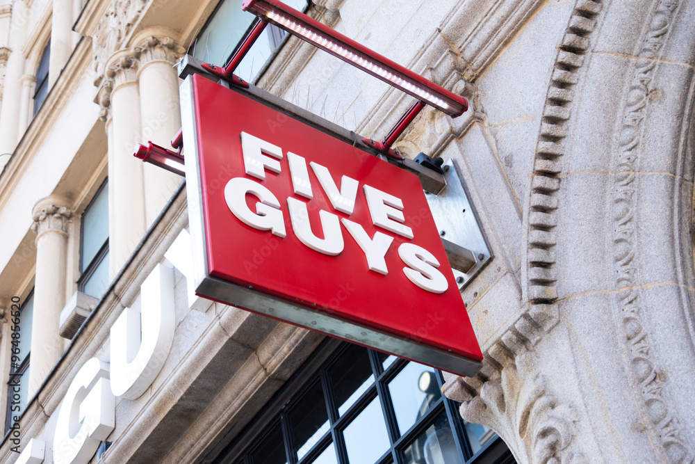 iconic Five Guys restaurant exterior, red sign Five Guys stands out ...