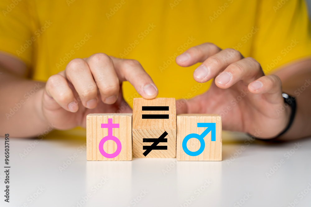 A hand changes an unequal sign to an equal sign between male and female ...