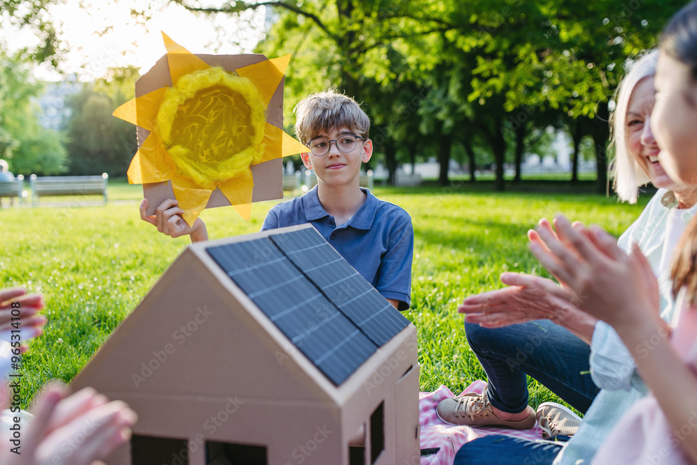 Children learning about renewable energy and solar panels during ...