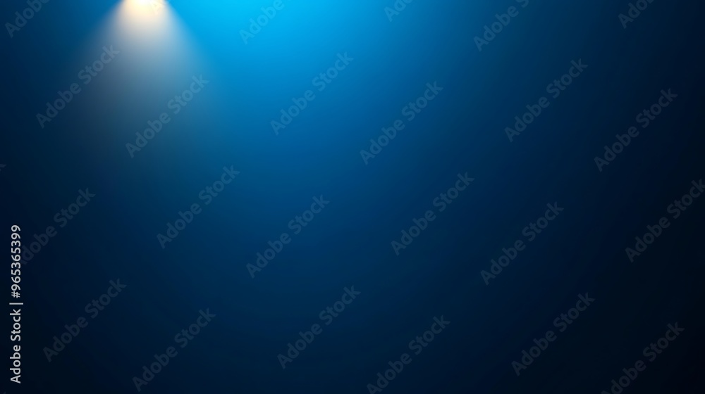 Rich cobalt blue background with a single warm spotlight shining from ...