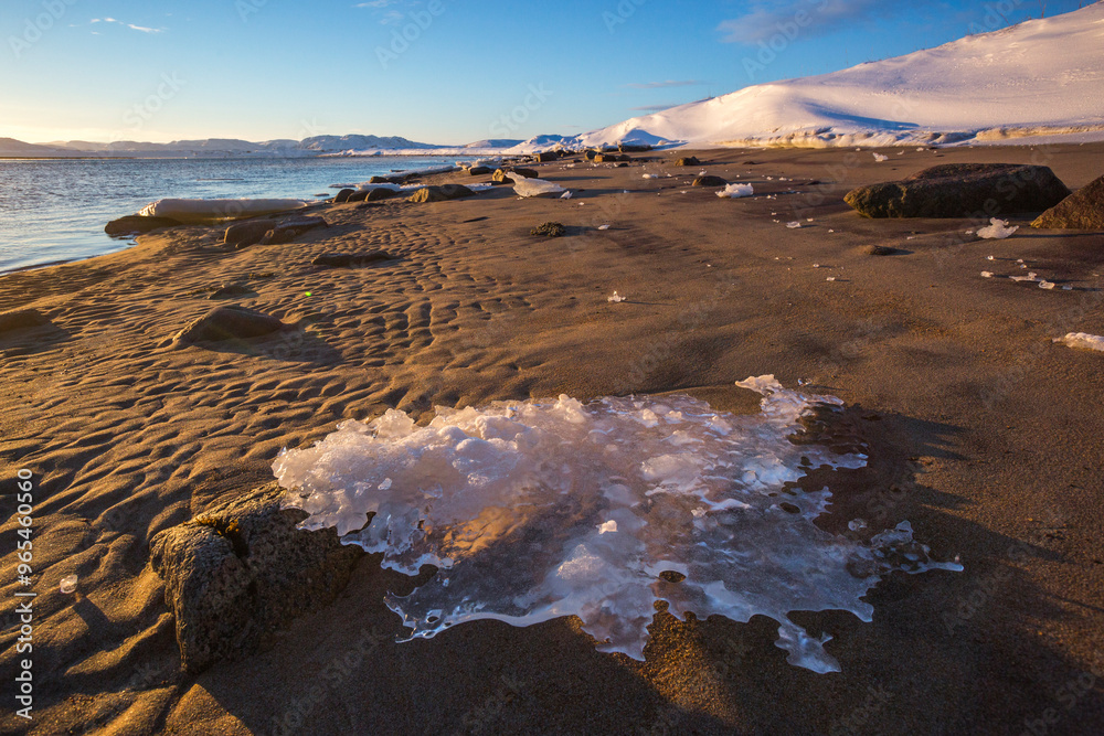 Shore sand of Guba Voronya, Barents Sea bay. Kola Peninsula landscape ...
