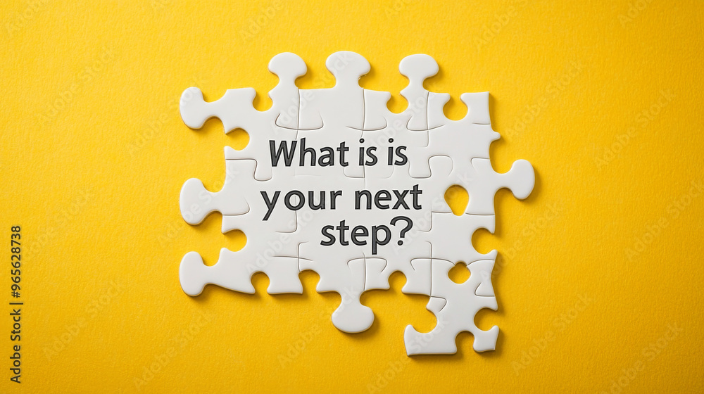 A white puzzle piece with the words "What is your next step?" on a ...