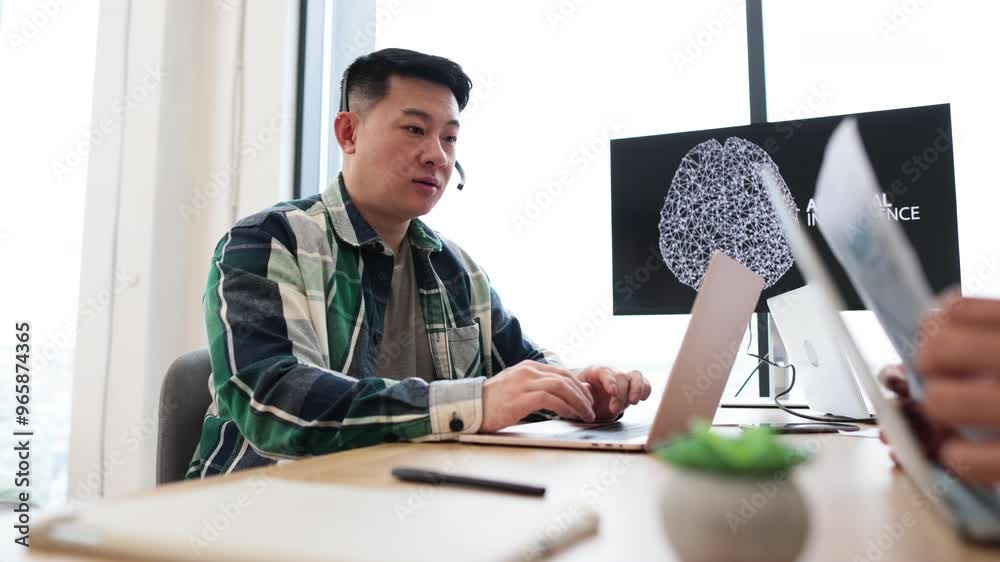 IT professional in headset working on advancements in artificial ...