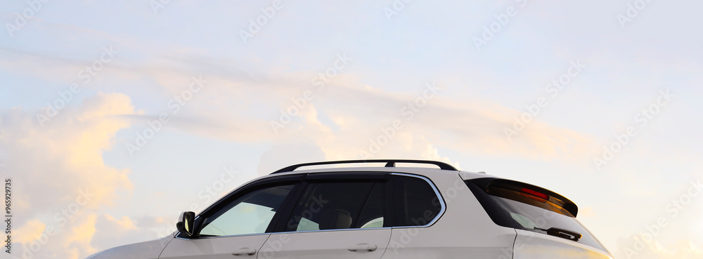 White luxury SUV car, at Road on cloudy sunset sky background ...