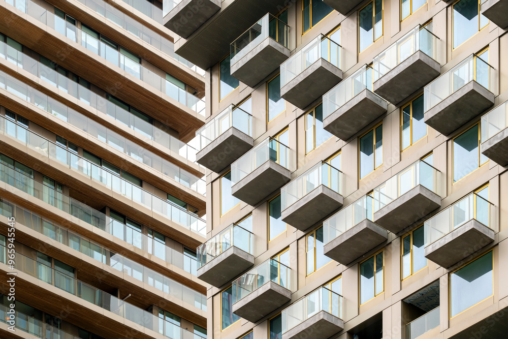 This image showcases a side view of a modern apartment building with ...