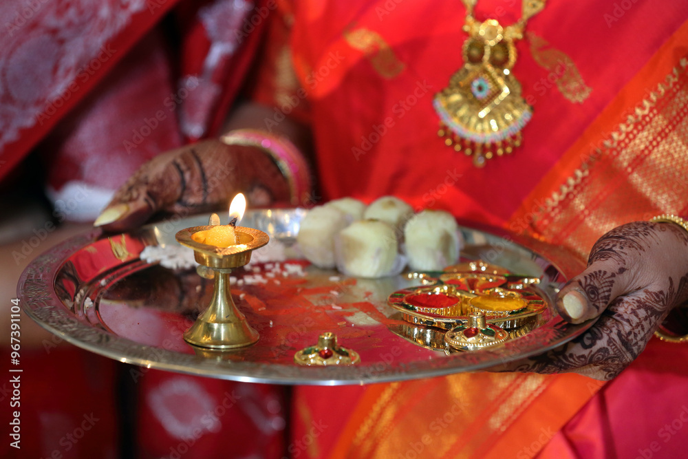 Indian pooja thali is a decorated plate used for rituals, containing a ...