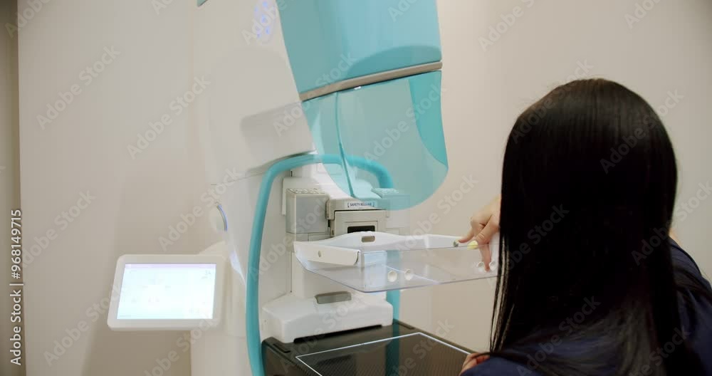 Female doctor examines and prepares the diagnostic machine in the ...