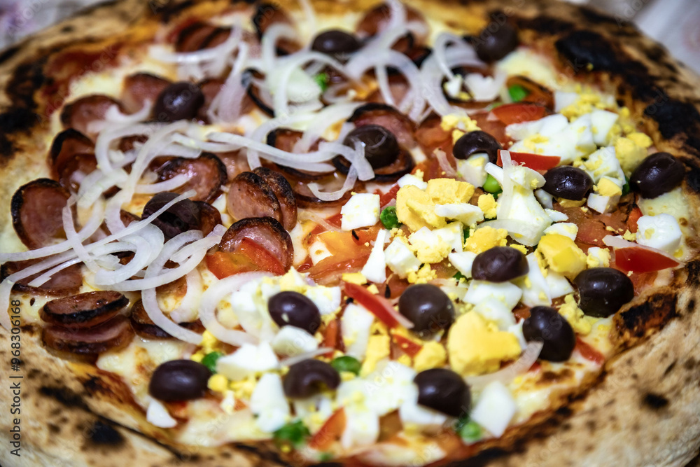 Traditional Brazilian pizza, half pepperoni with onions and half ...