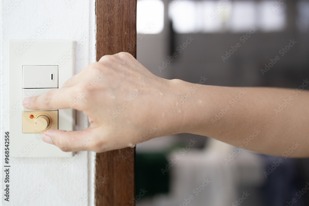 Close up,wet hand,asian woman using her finger to turn off the light ...