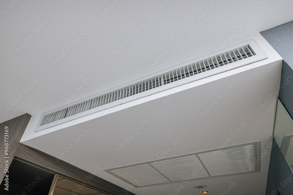 Hotel air conditioner ceiling grill, interior closeup air flow pipe ...