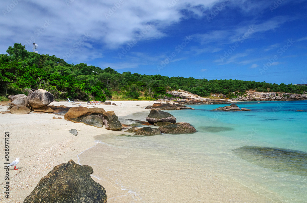 Picturesque tropical golden sandy Sunset Beach with turquoise water on ...