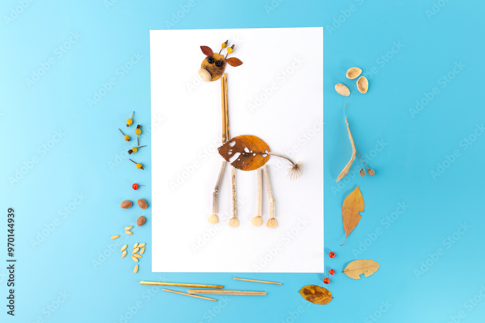 Giraffe art made from various foliage. Long neck, small head with eyes ...