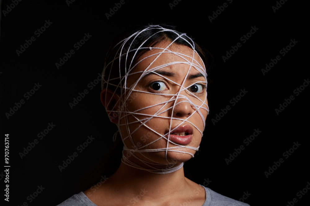 Woman, rope and scared face for crime, kidnapping and danger with ...