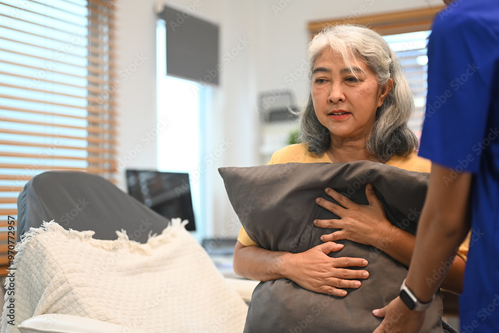 Physical therapist doing back percussion on a senior patient to help ...