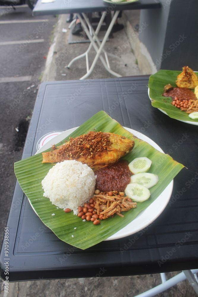 Nasi Lemak berlauk ikan Talapia. Coconut rice with fried Talapia fish ...