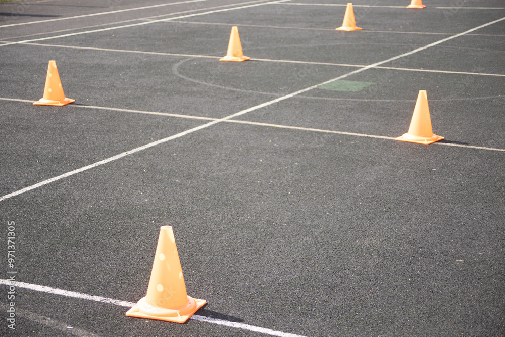 Sports ground. Orange cones on the playground. Relay race in the street ...