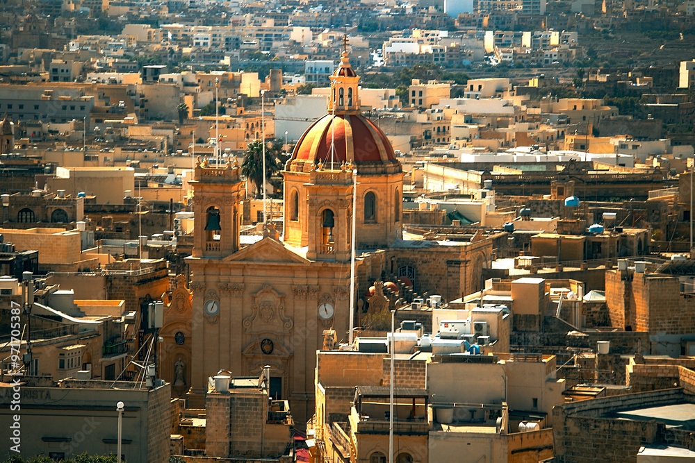 Aerial view of a historic city with a prominent church featuring a red ...