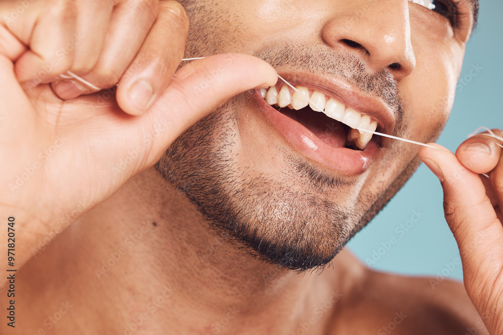 Studio, closeup and man with floss for dental, gum health and wellness ...