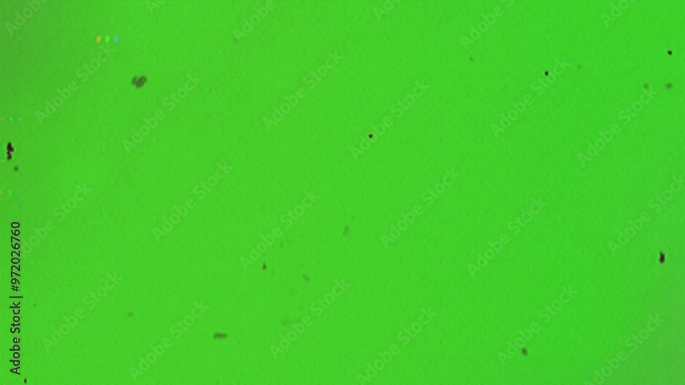 Dust particles animation on a green background with light leaks and ...