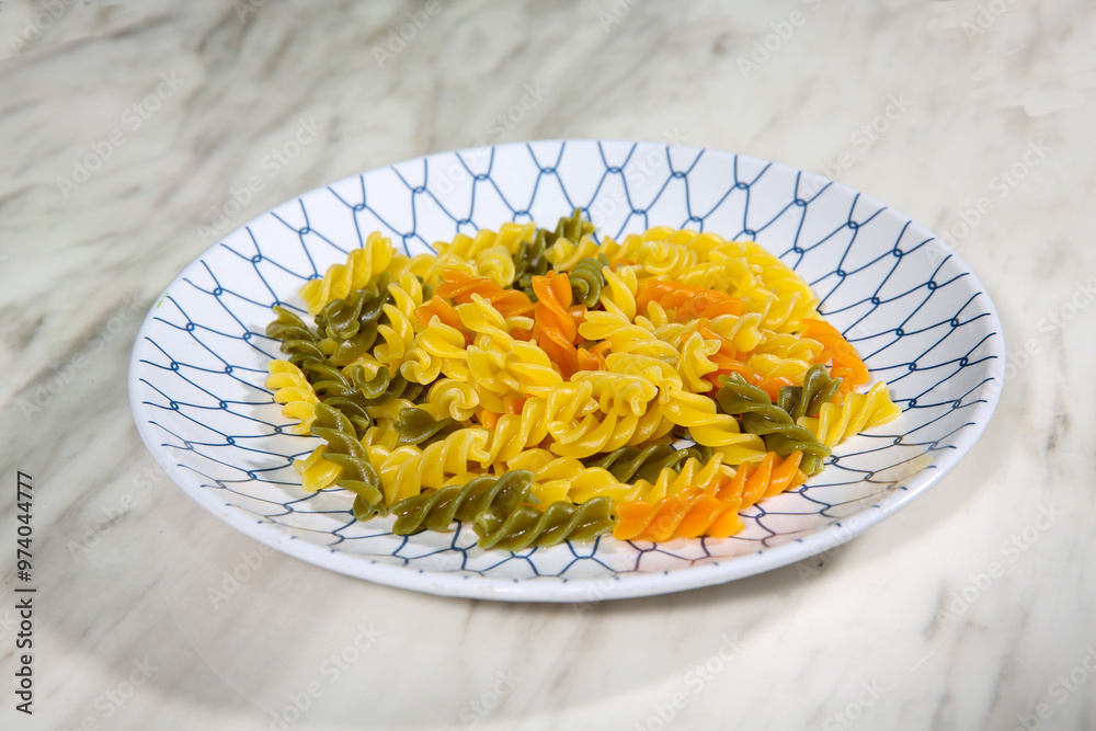 pasta noodles, showcasing their golden hue and smooth texture. The ...