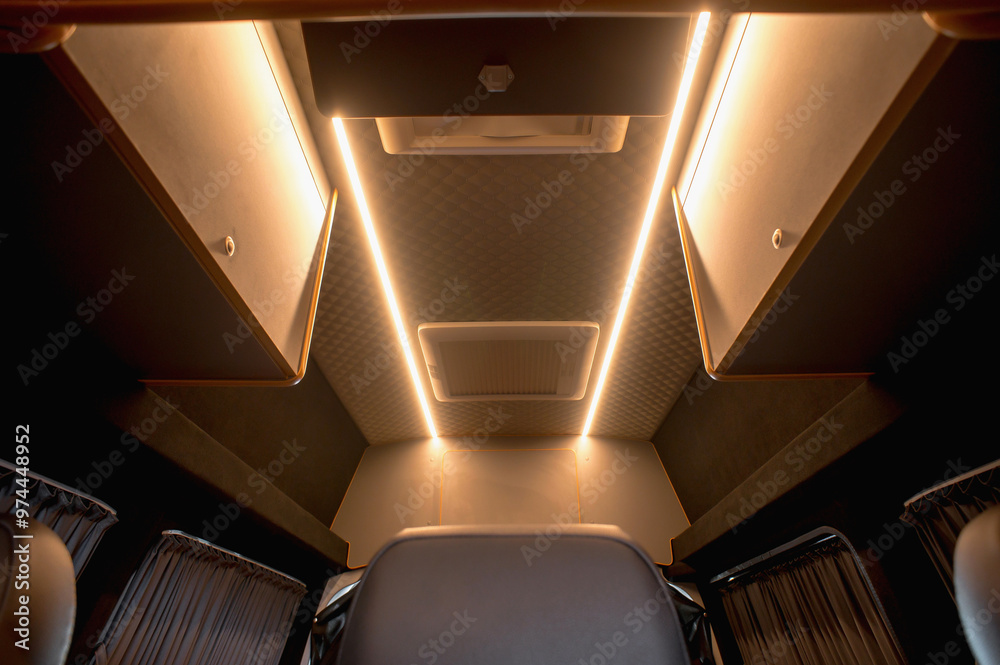 Comfortable interior of a passenger bus with soft seats. The design is ...