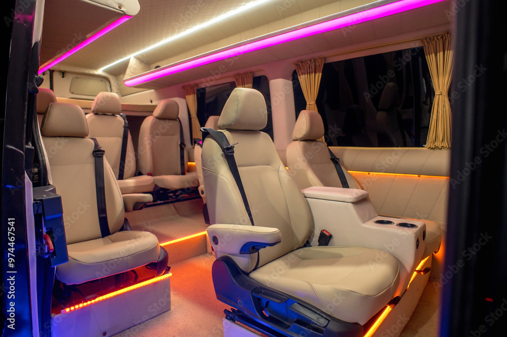 Comfortable interior of a passenger bus with soft seats. The design is ...