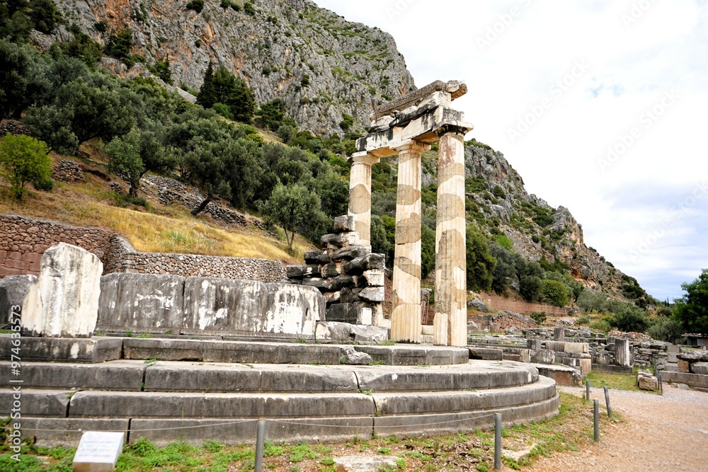 Stone remains of a tholos, a sacred circular building with columns in ...