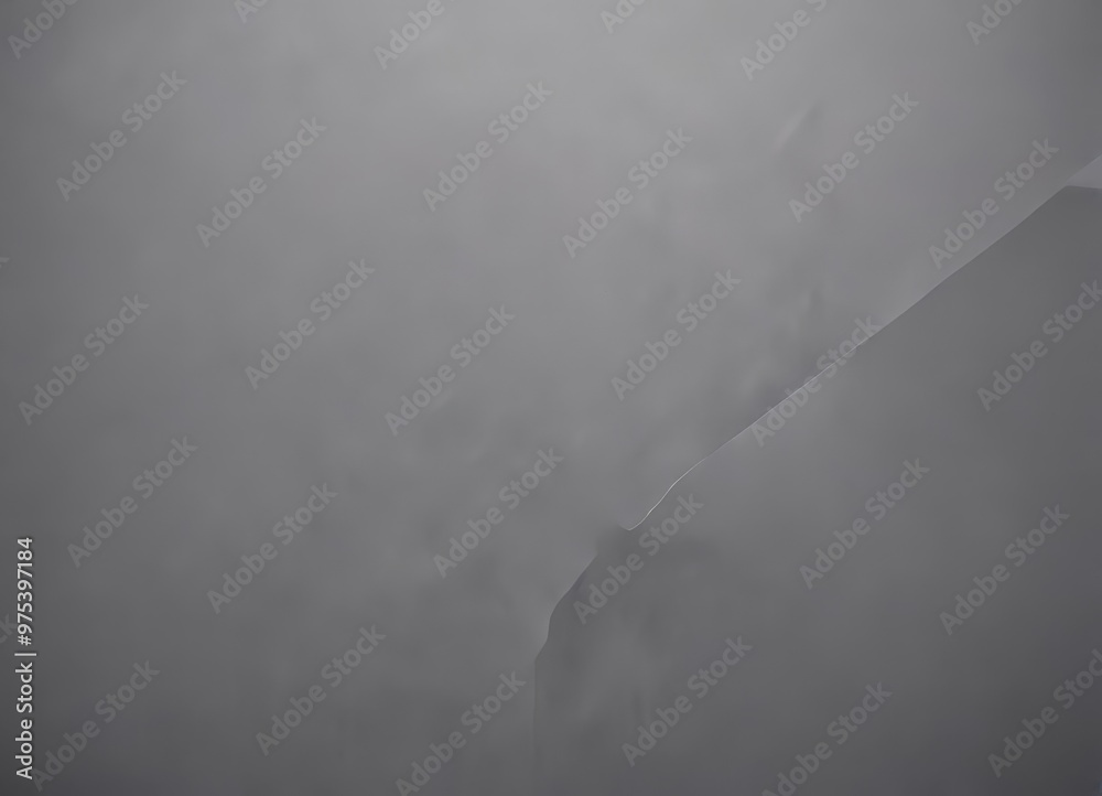 a hazy, gray sky with a faint outline of a mountain or hill in the top ...