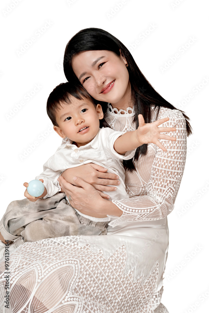 Loving Asian mother holding her young son, smiling and enjoying a ...
