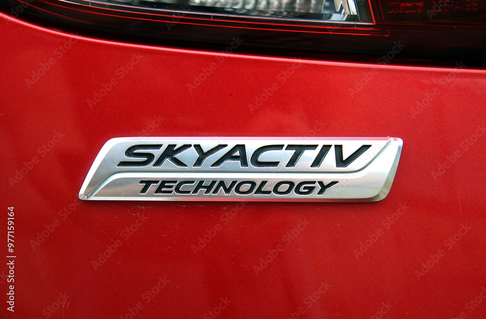 Vinnytsia, Ukraine; September 14, 2024. Red Mazda 3 skyactiv emblem and ...