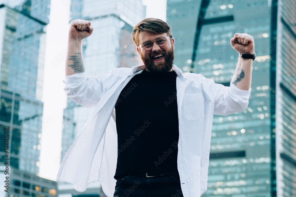 Full length portrait of cheerful male tourist celebrating international ...