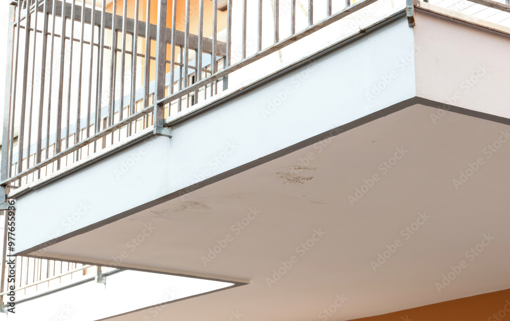 Water infiltration damaging the ceiling of a building, highlighting the ...