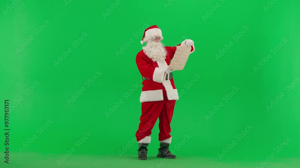 Portrait of man dressed as Santa on chroma key green screen background ...