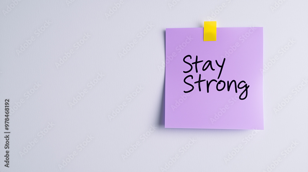 Sticky Note: A single violet sticky note with the words "Stay Strong ...
