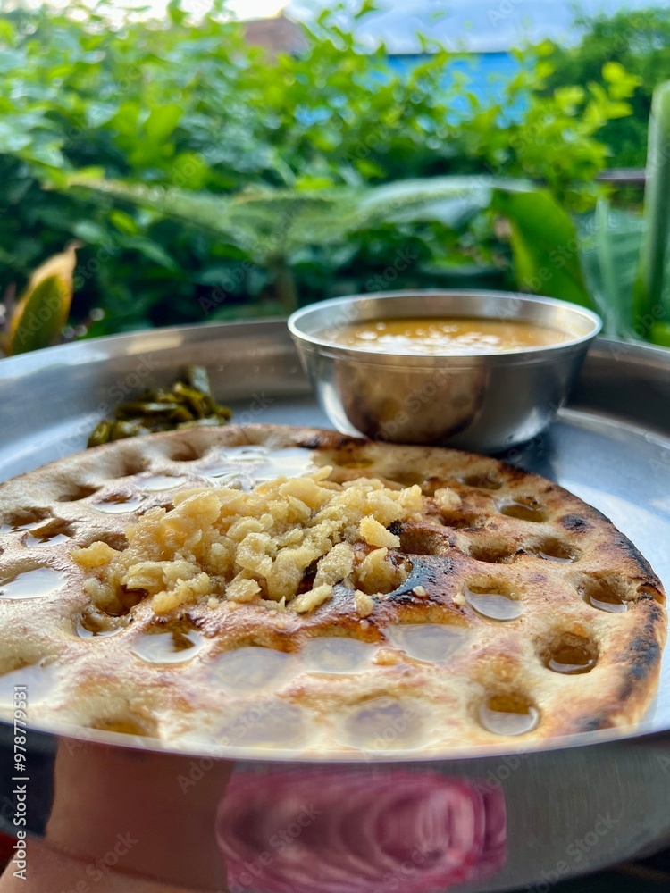 Famous rajasthani roti khuba roti garnished with jaggery or gud in a ...