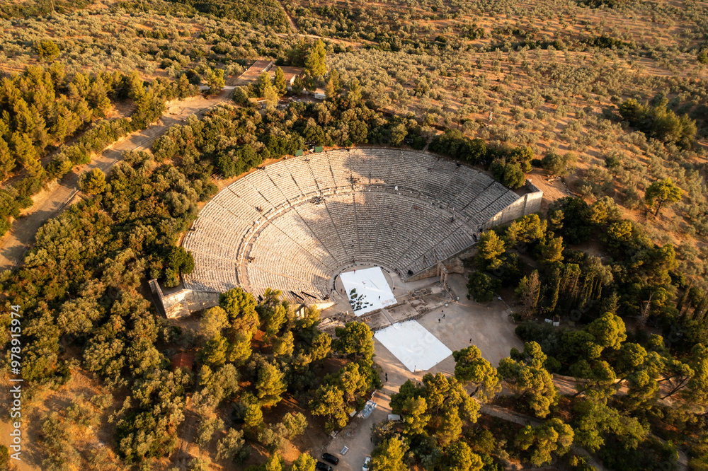 Aerial view of the ancient amphitheater surrounded by trees and scenic ...