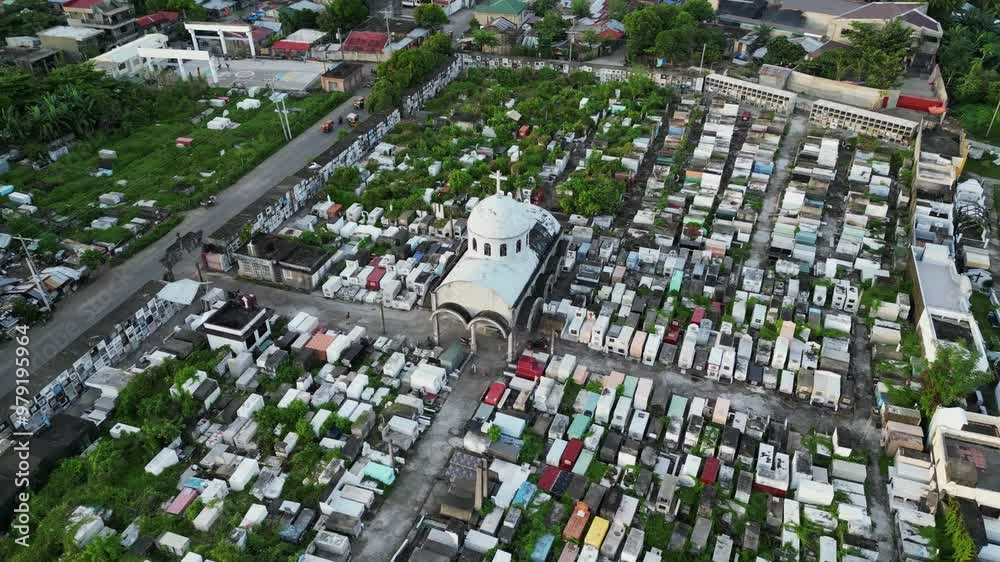 Rotating aerial view of Philippine Catholic cemetery and memorial with ...