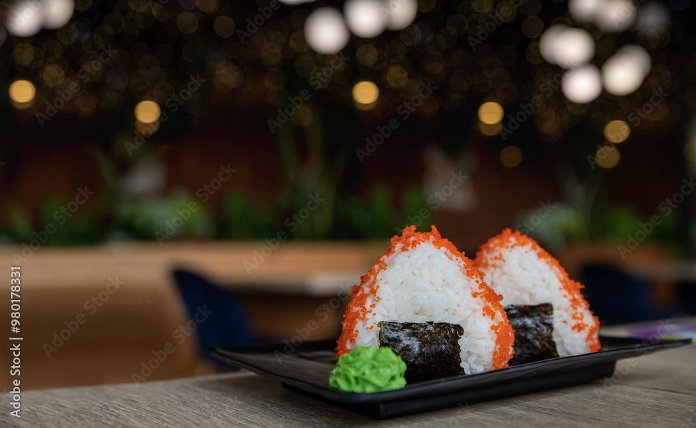 Onigiri or japanese rice balls served on the wooden tabletop in the ...