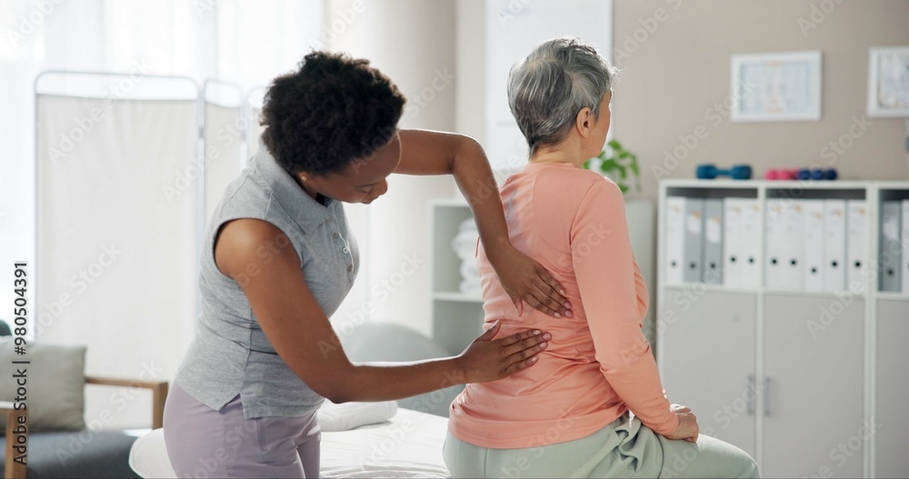 Woman, physiotherapist and patient with back pain for injury or medical ...