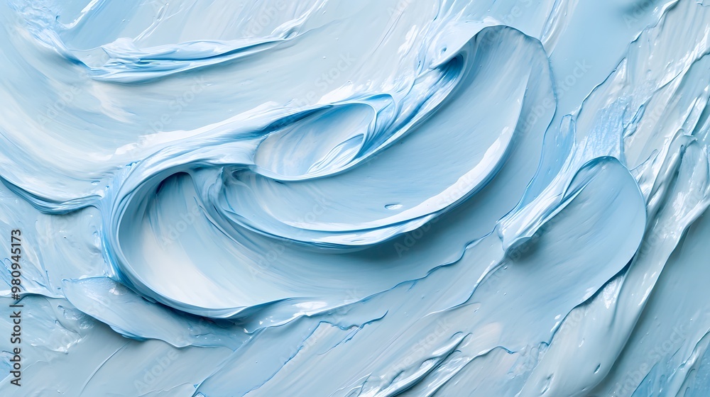 Light blue paint texture is captured in close-up, showcasing thick ...