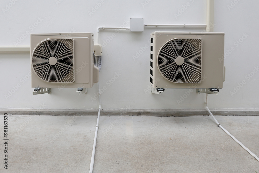 Air conditioner compressor installed in old building. Outdoor split ...