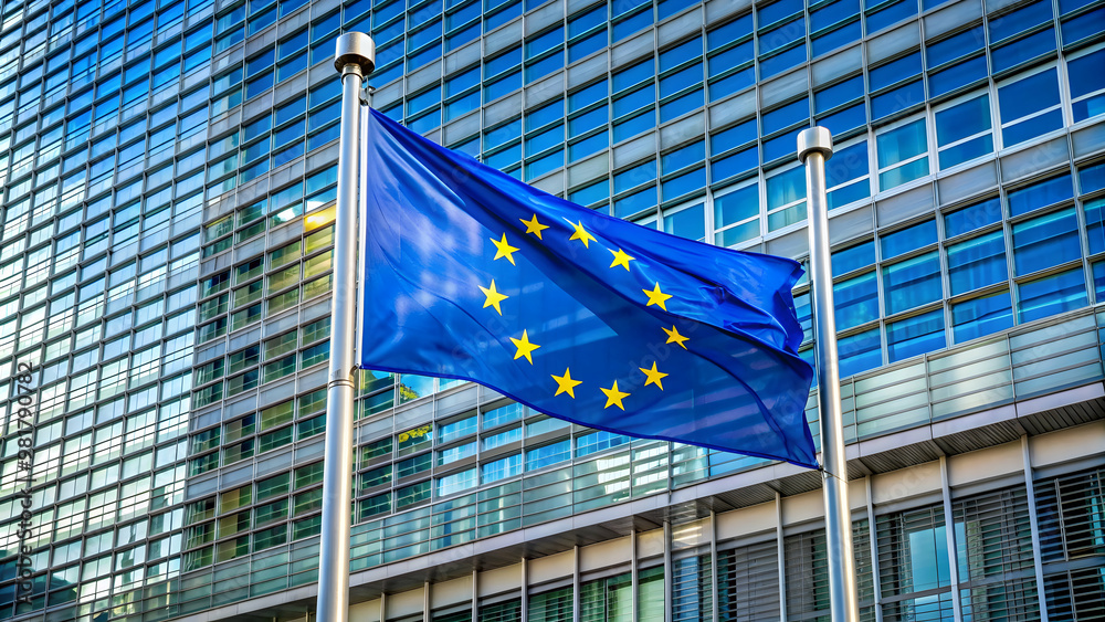 European Union flag hanging in front of a sleek, modern building ...