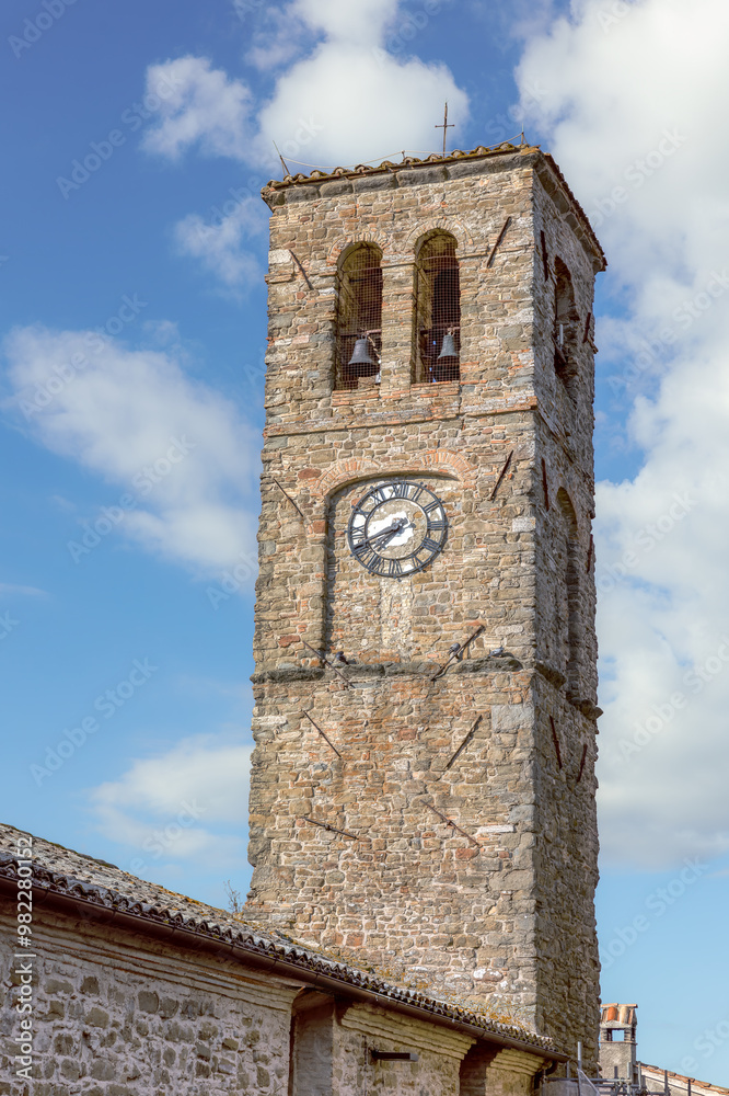 The medieval bell tower in Collemancio, Umbria proudly stands with its ...