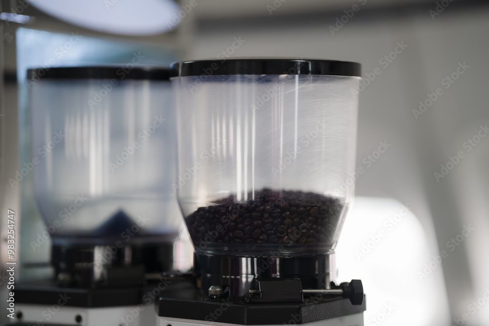 Coffee Bean Hopper: Close-up of a coffee bean hopper filled with dark ...