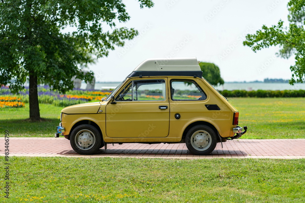 Side view Polish Fiat 126 (Polski Fiat 126p - "Maluch") in yellow color ...