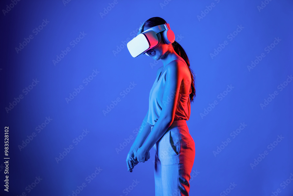 Smart female standing wearing VR headset connecting metaverse, future ...