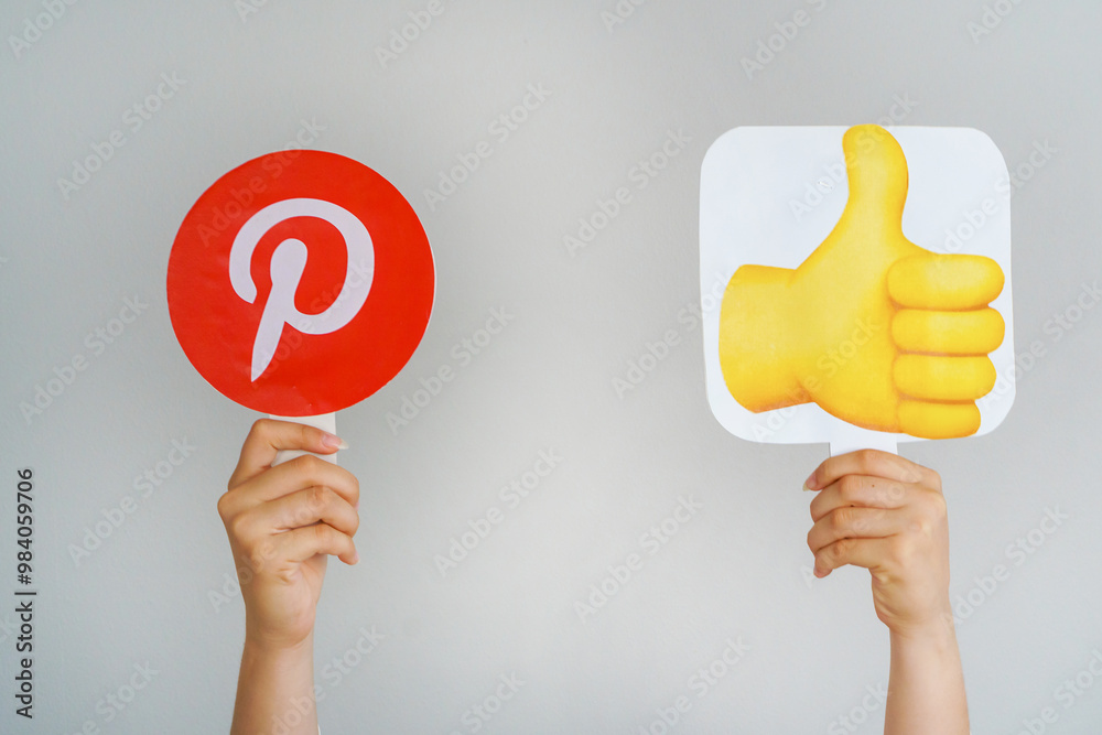 Girl holding icon with Pinterest logo and thumbs up emoji. Pinterest is ...