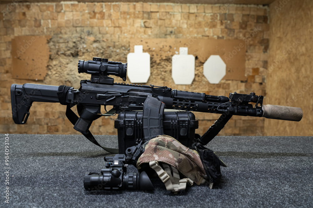 Tactical shooting at a shooting range, AK series rifle with a silencer ...