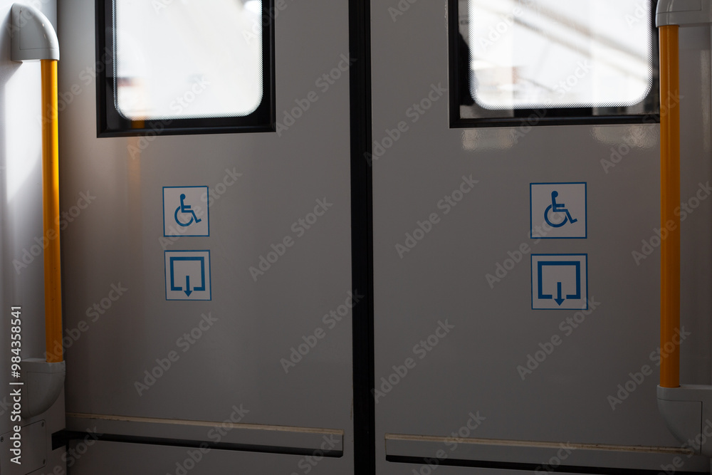 Equipped exit for disabled people in public transport with sticker ...