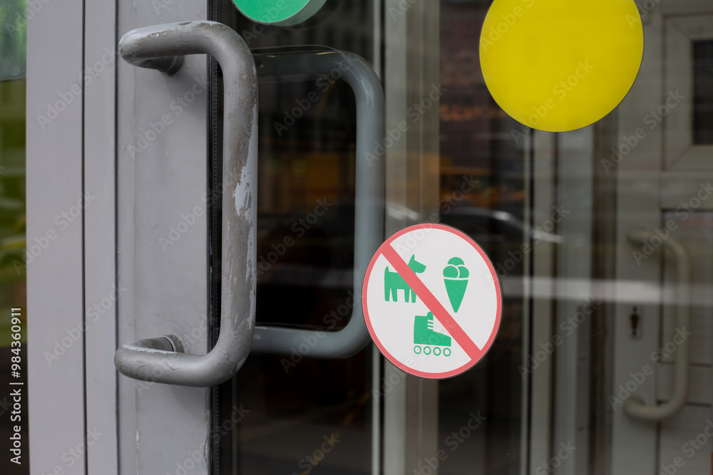 Sign prohibiting entry into building with dog, on roller skates and ...